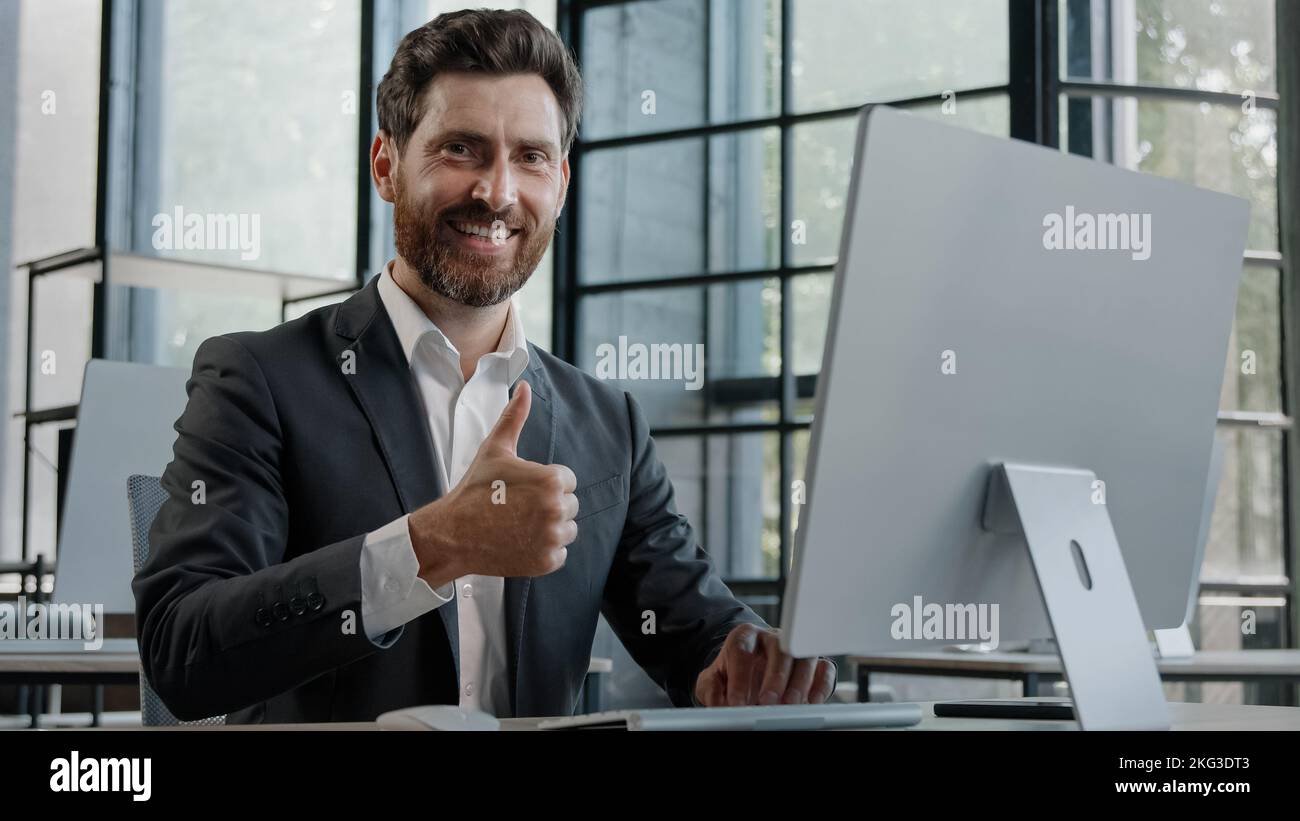 Middle-aged adult bearded 40s businessman worker working with computer ...