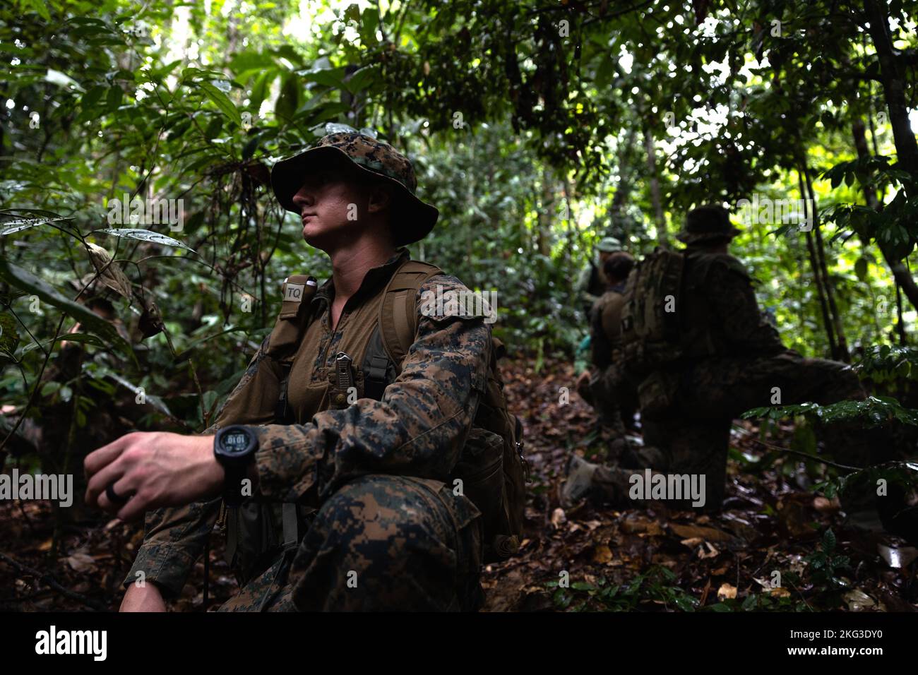 U.S. service members provide security during a pause while conducting a ...