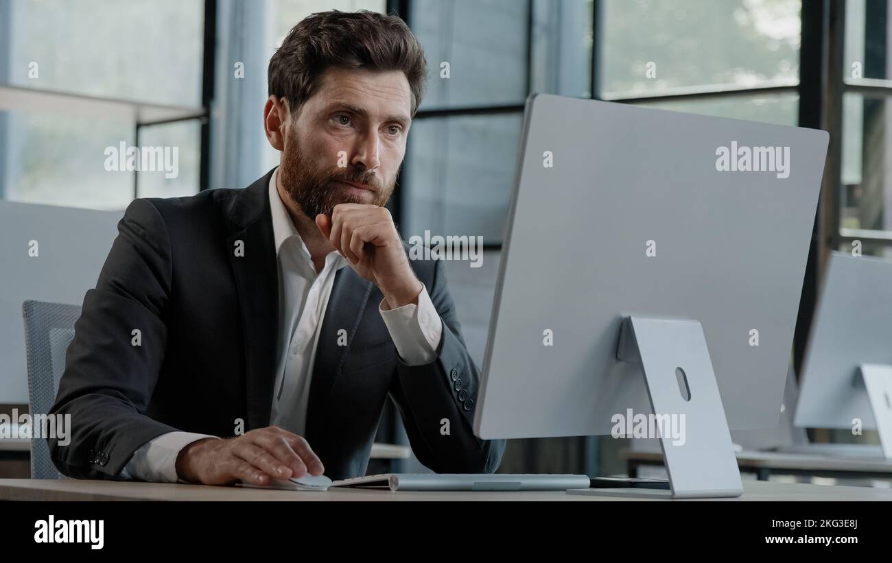 Busy pensive focused Caucasian bearded adult 40s man CEO company worker ...