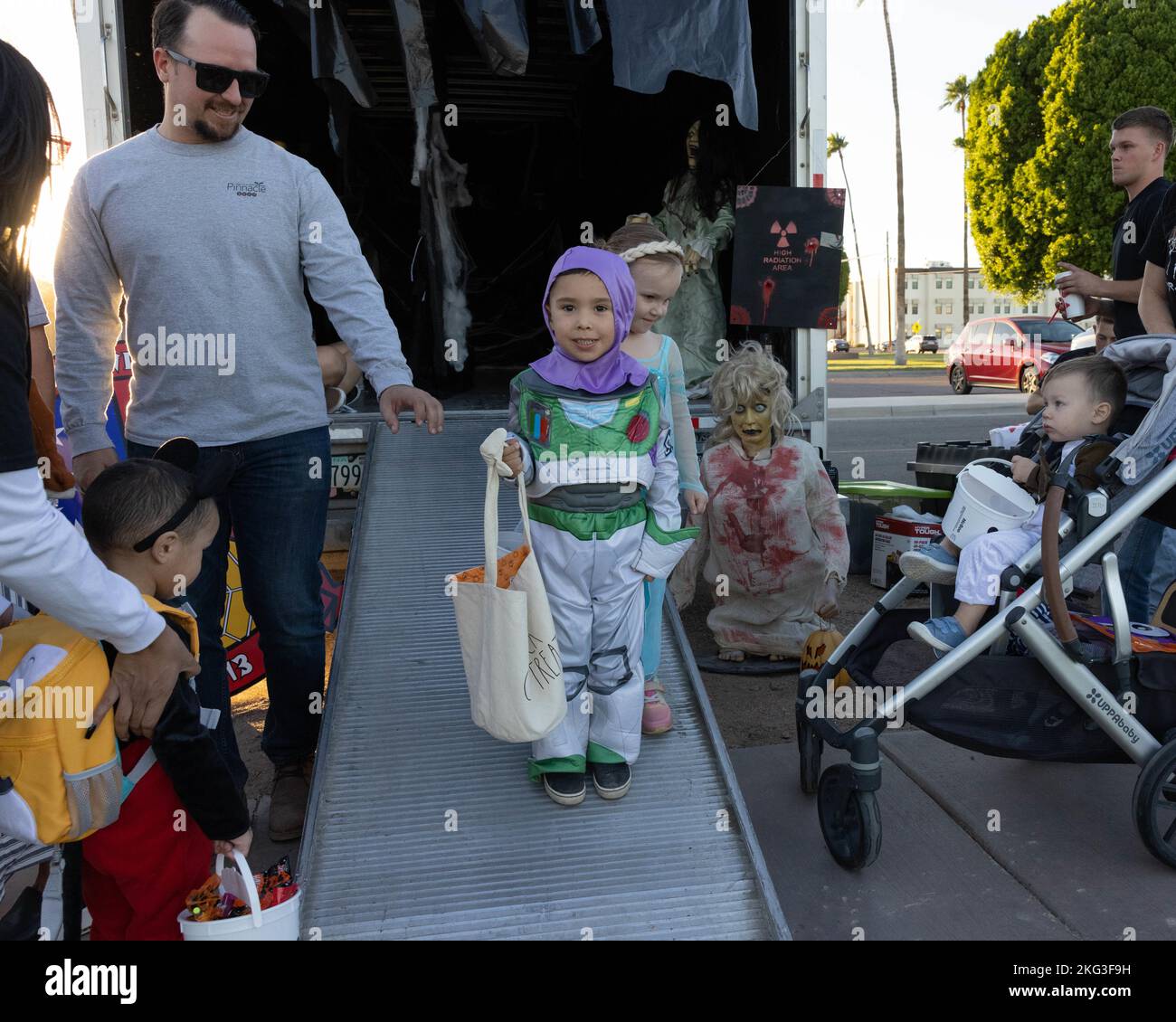 A child dressed up in a costume participates in the 8th annual Trunk or ...