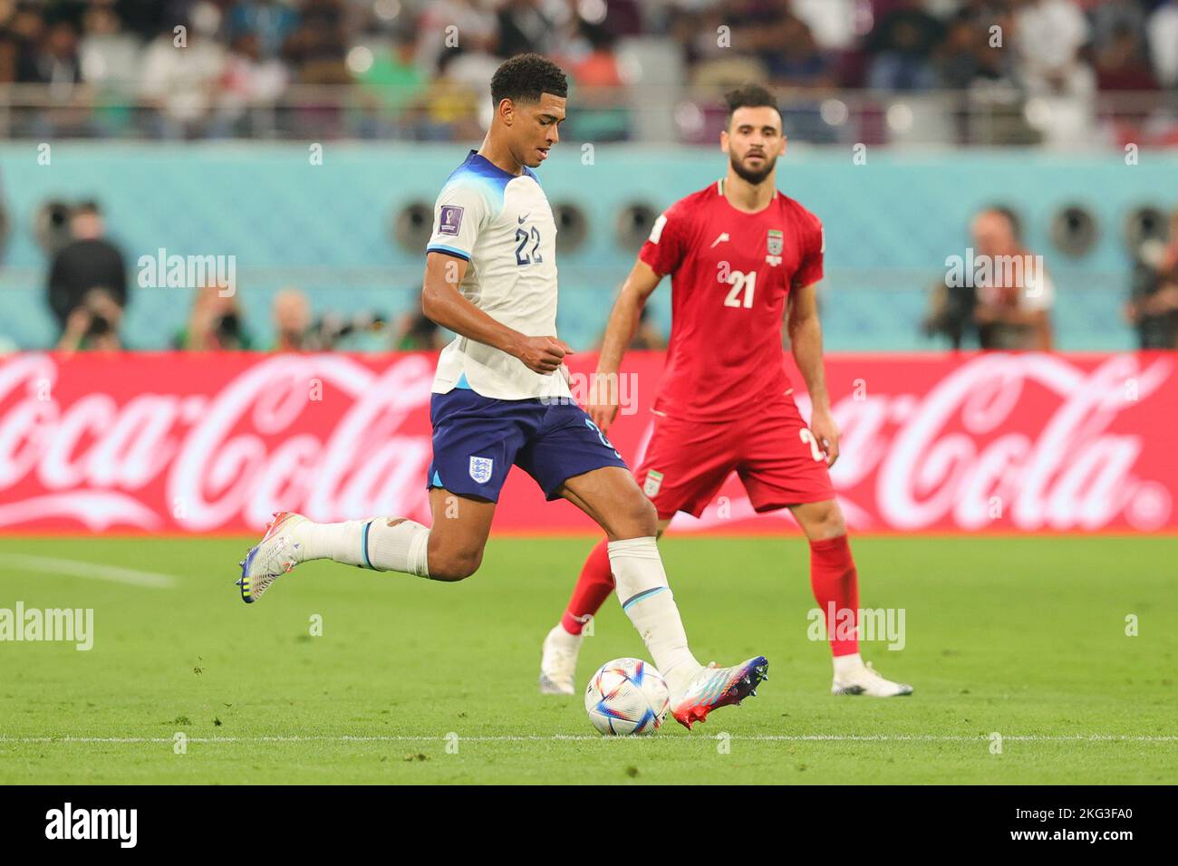 Doha, Qatar. 21st Nov, 2022. Jude Bellingham of England passes the ball ...