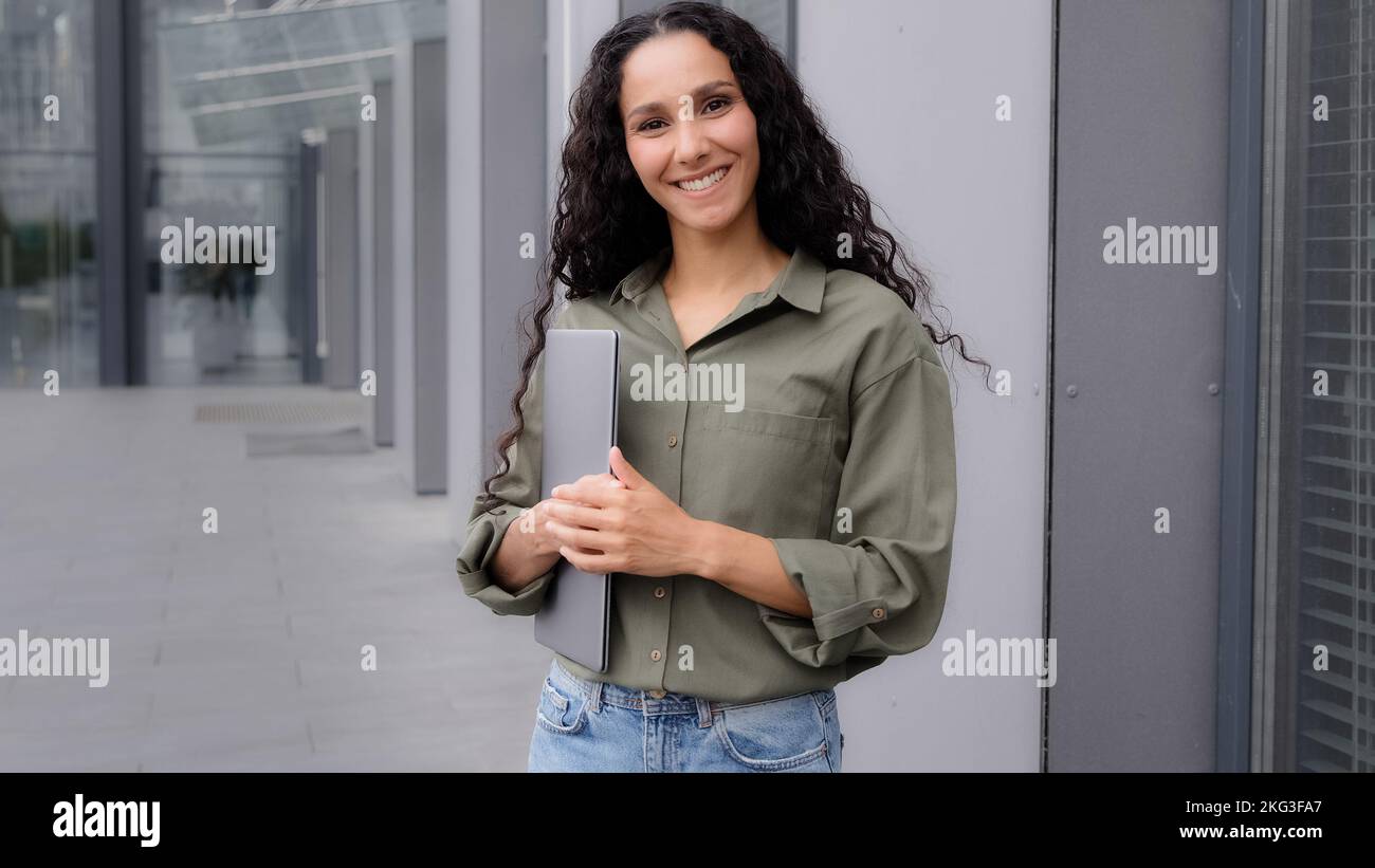 Smiling Latina Caucasian Hispanic 30s woman with laptop businesswoman ...