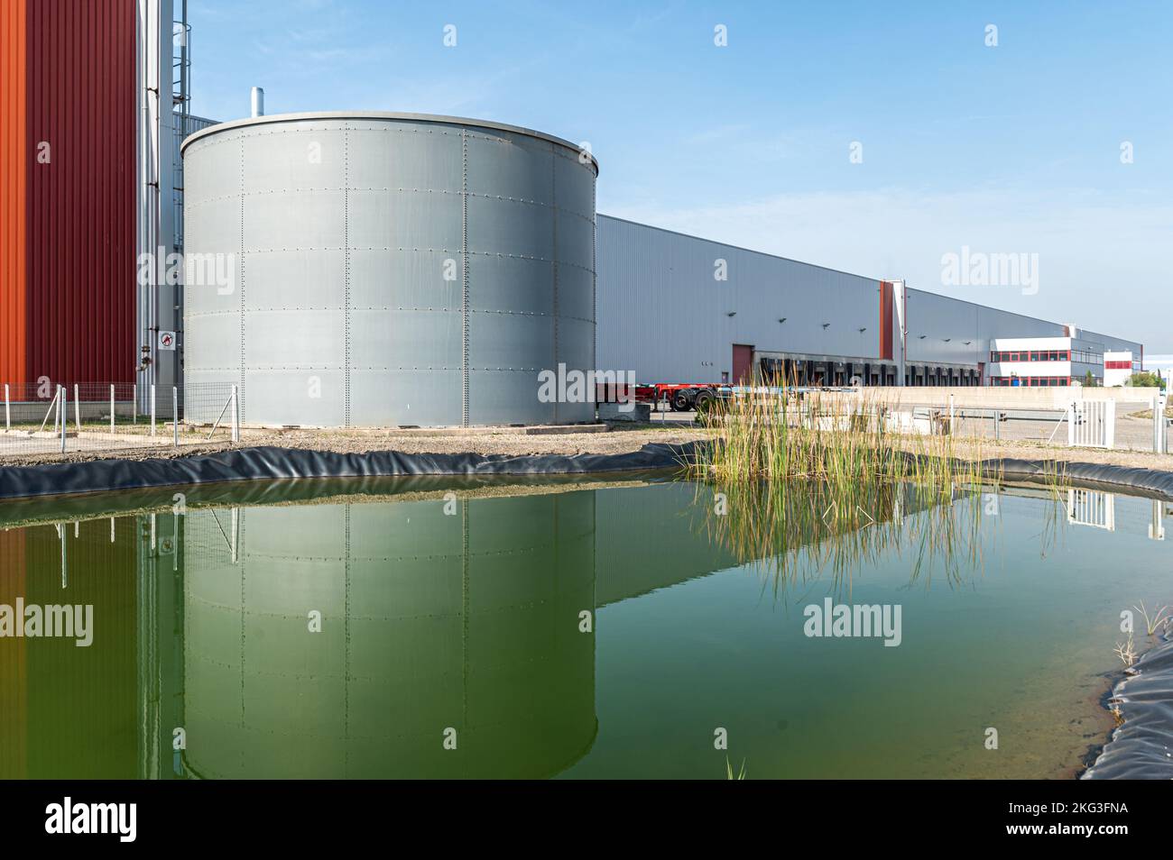 Low angle perspective shot of round shaped water tank in front of ...