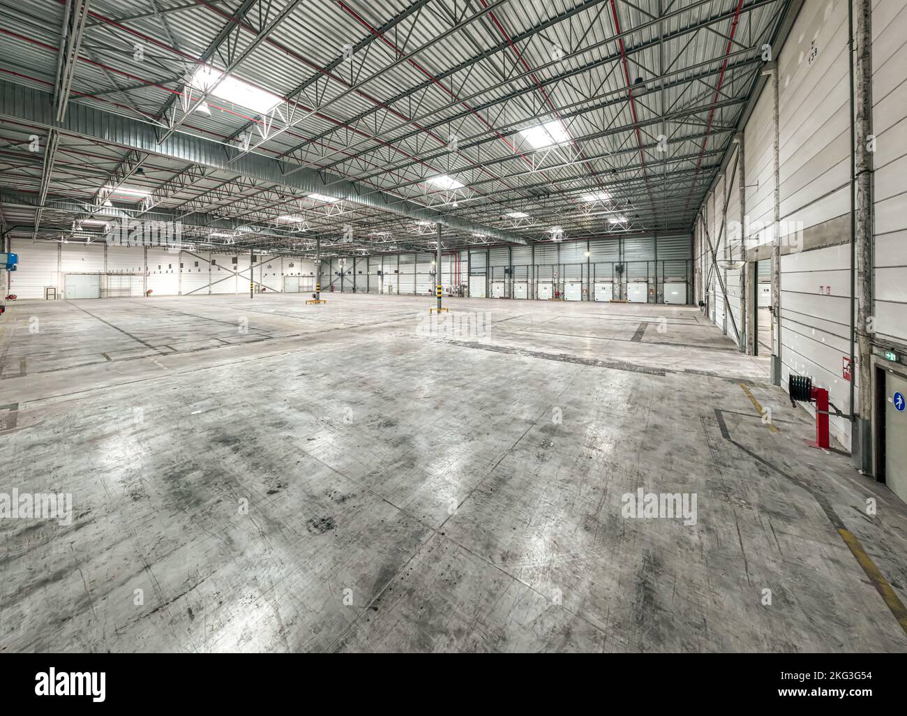 Perspective shot of covered warehouse where polished concrete empty ...