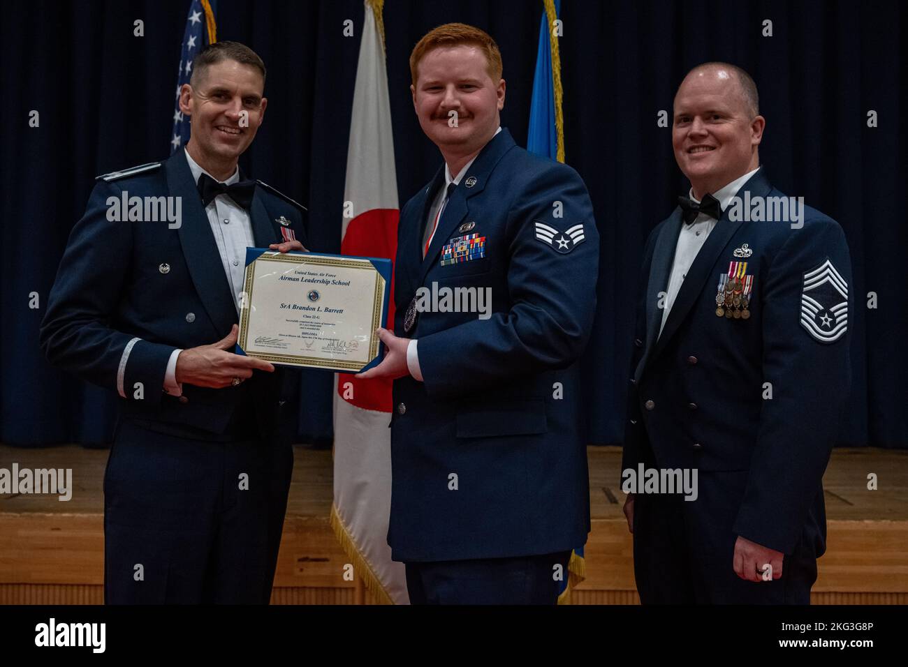 U.S. Air Force Senior Airman Brandon Barrett, center, Airman Leadership ...