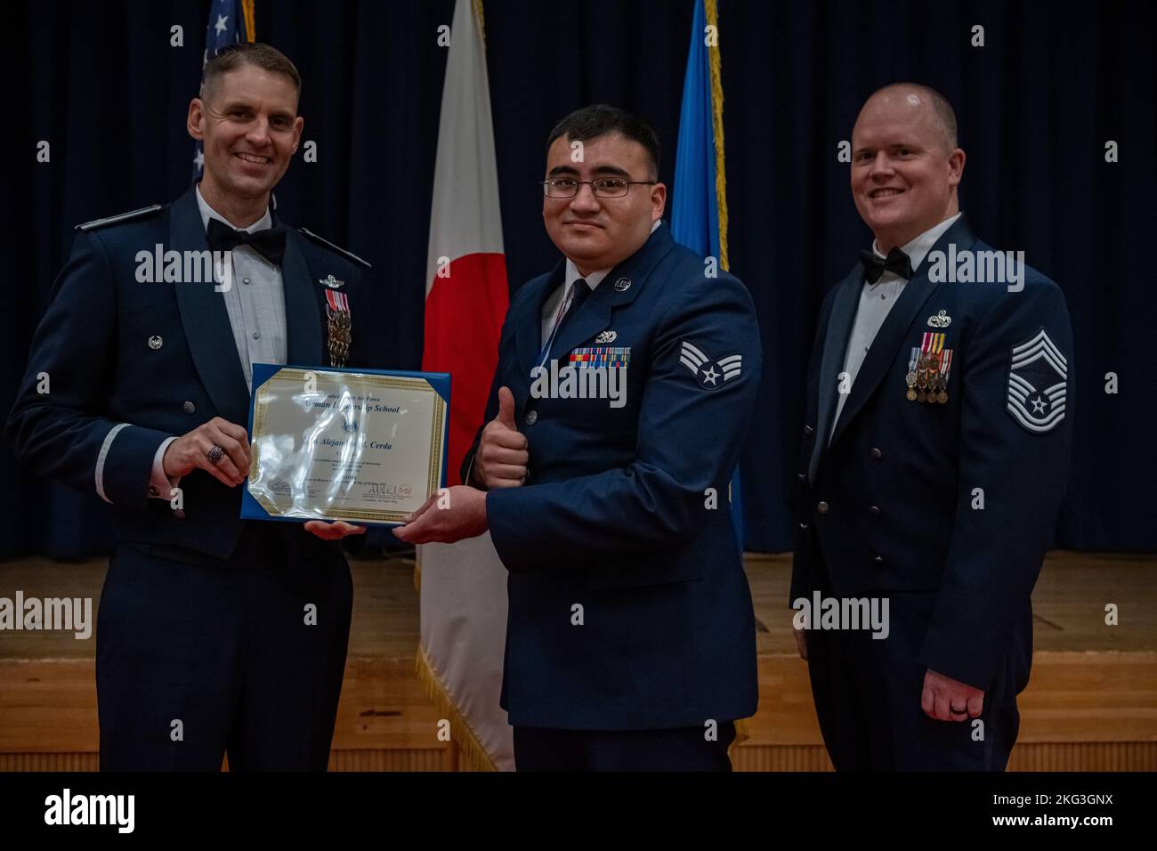 U.S. Air Force Senior Airman Alejandro Cerda, center, Airman Leadership ...