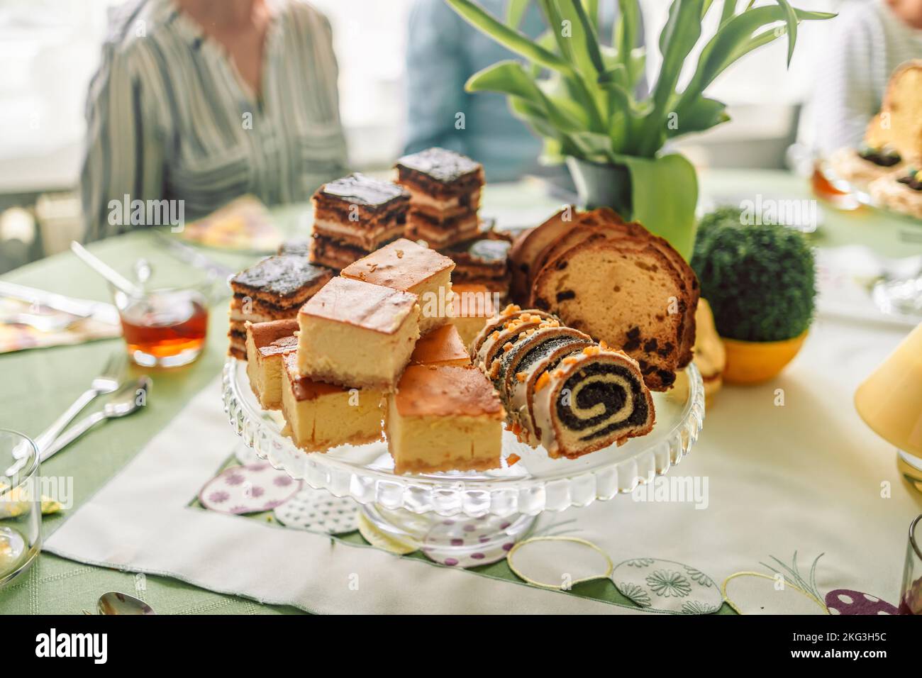 Different type of cakes on a plate and with side light Stock Photo - Alamy