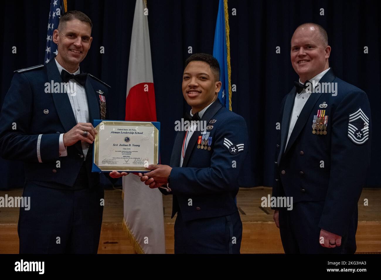 U.S. Air Force Senior Airman Joshua Young, center, Airman Leadership ...