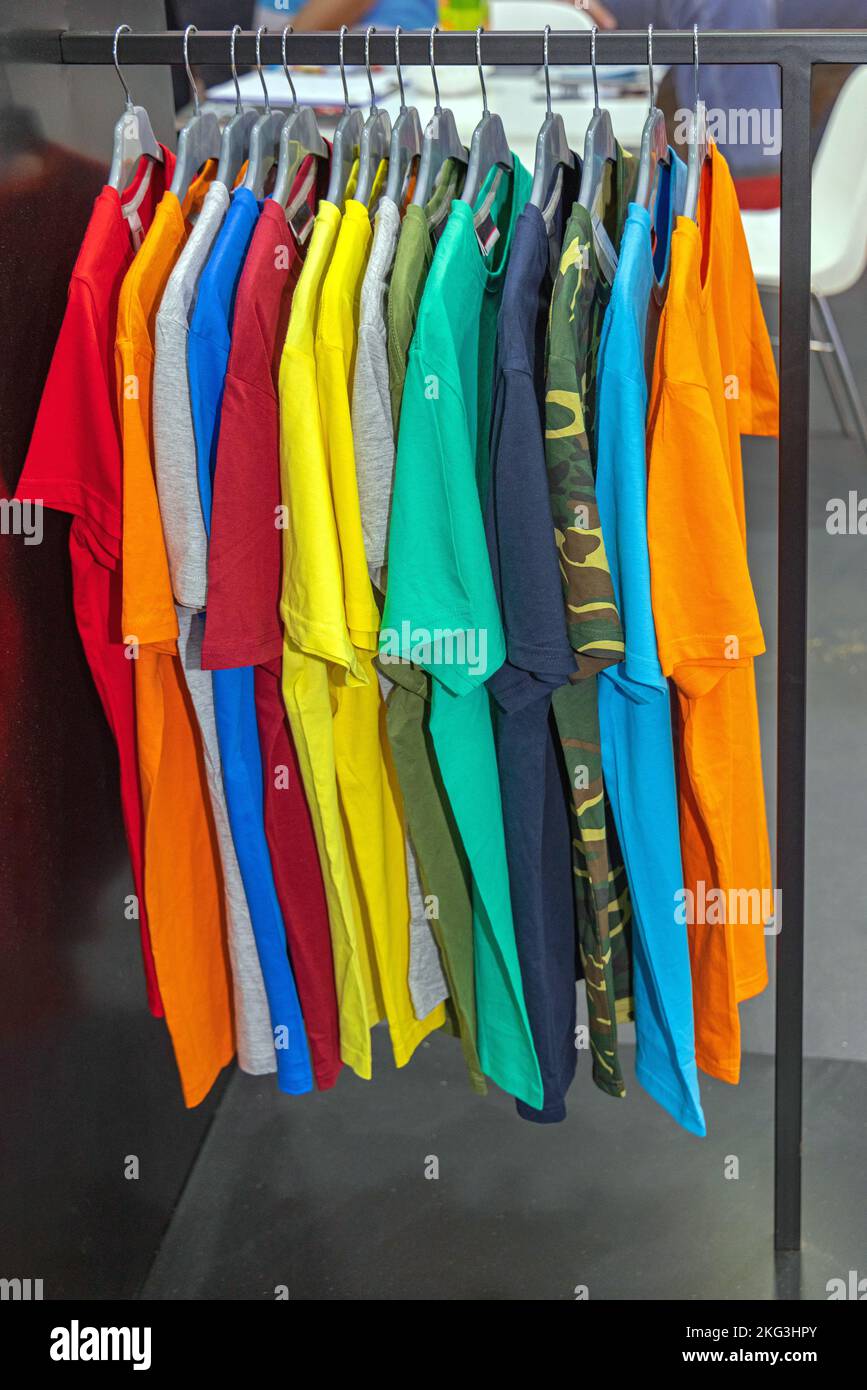 Colourful T Shirts Hanging at Rail New Clothing Stock Photo - Alamy