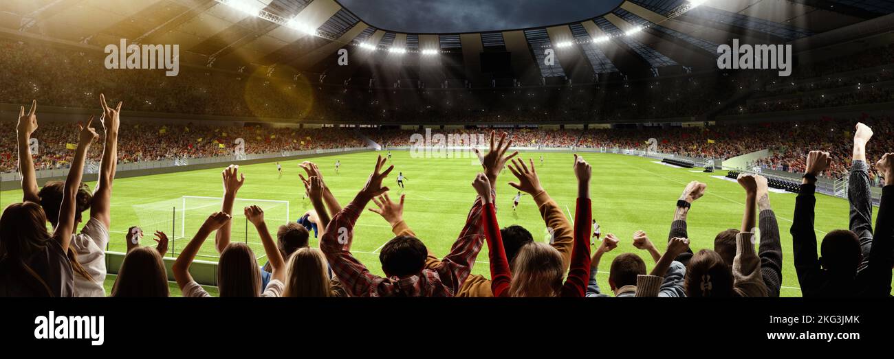 Back view of group of people, football soccer fans cheering at crowded ...