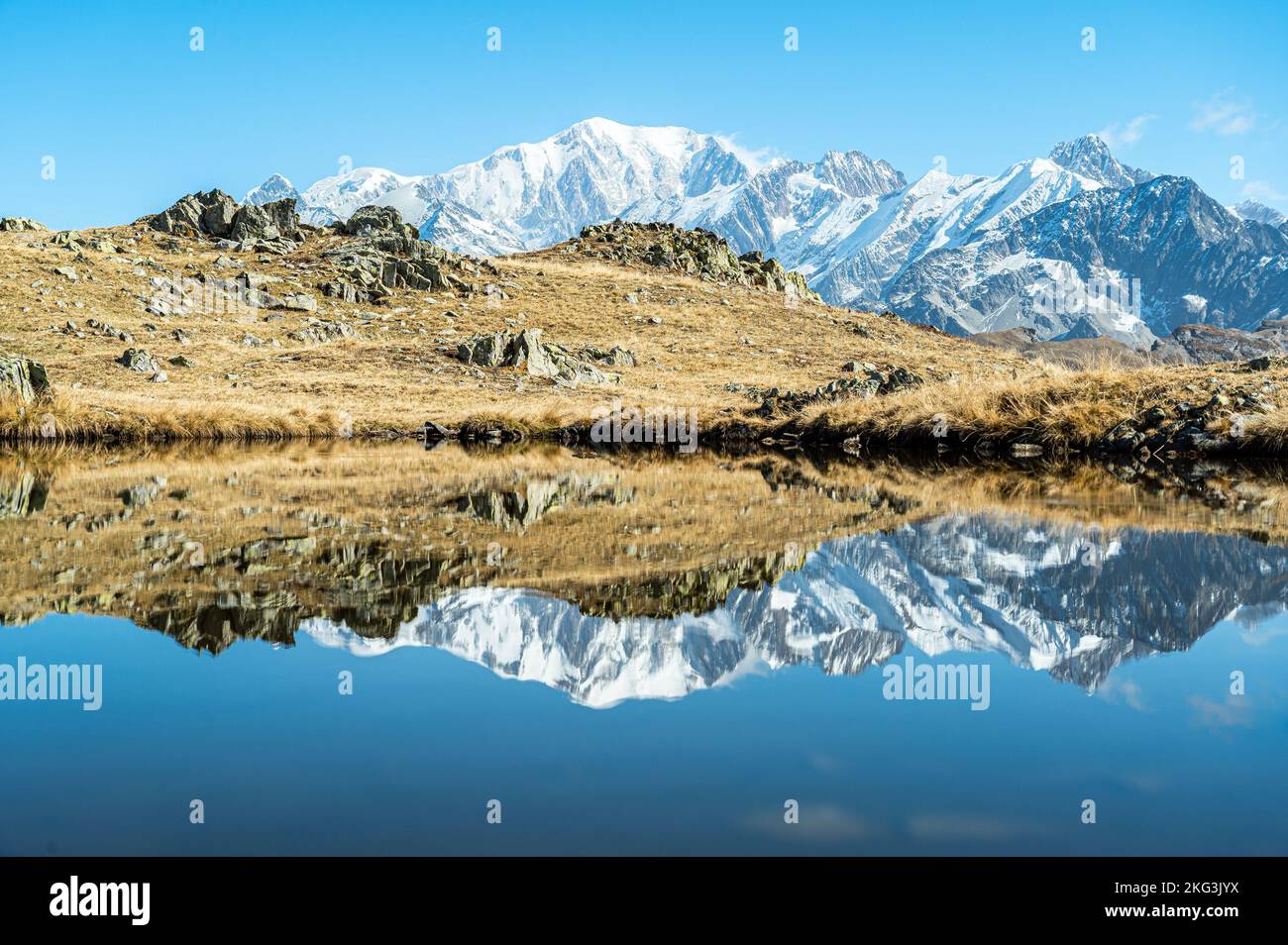 Perspective shot of glorious lake reflected iced mountain under ...