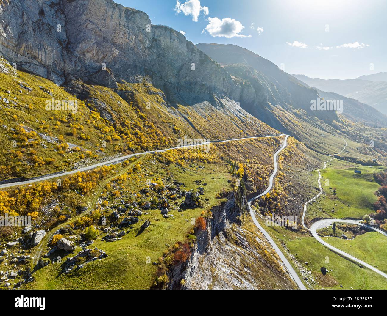 Aerial perspective of rolling mountain range surrounded by grazed area ...