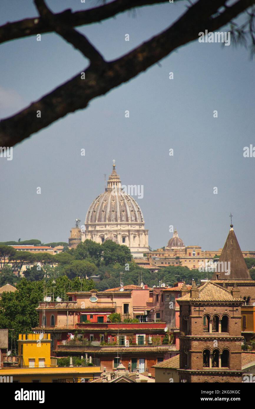 A vertical of St. Peter's Basilica in Vatican City around buildings and ...