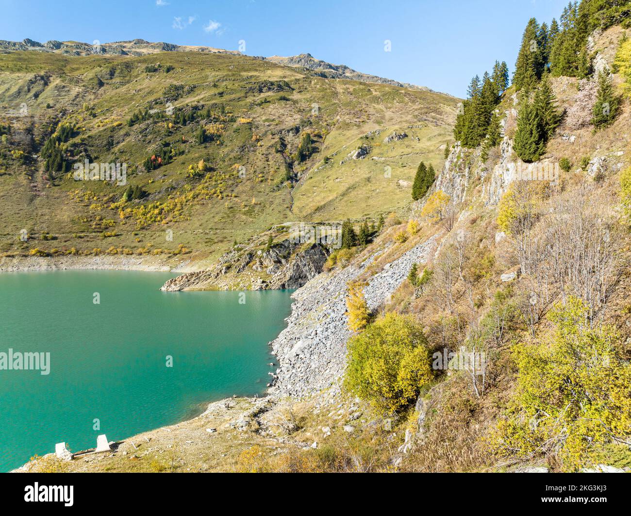 Aerial perspective of Beaufortain lake in Savoie surrounded by rocky ...