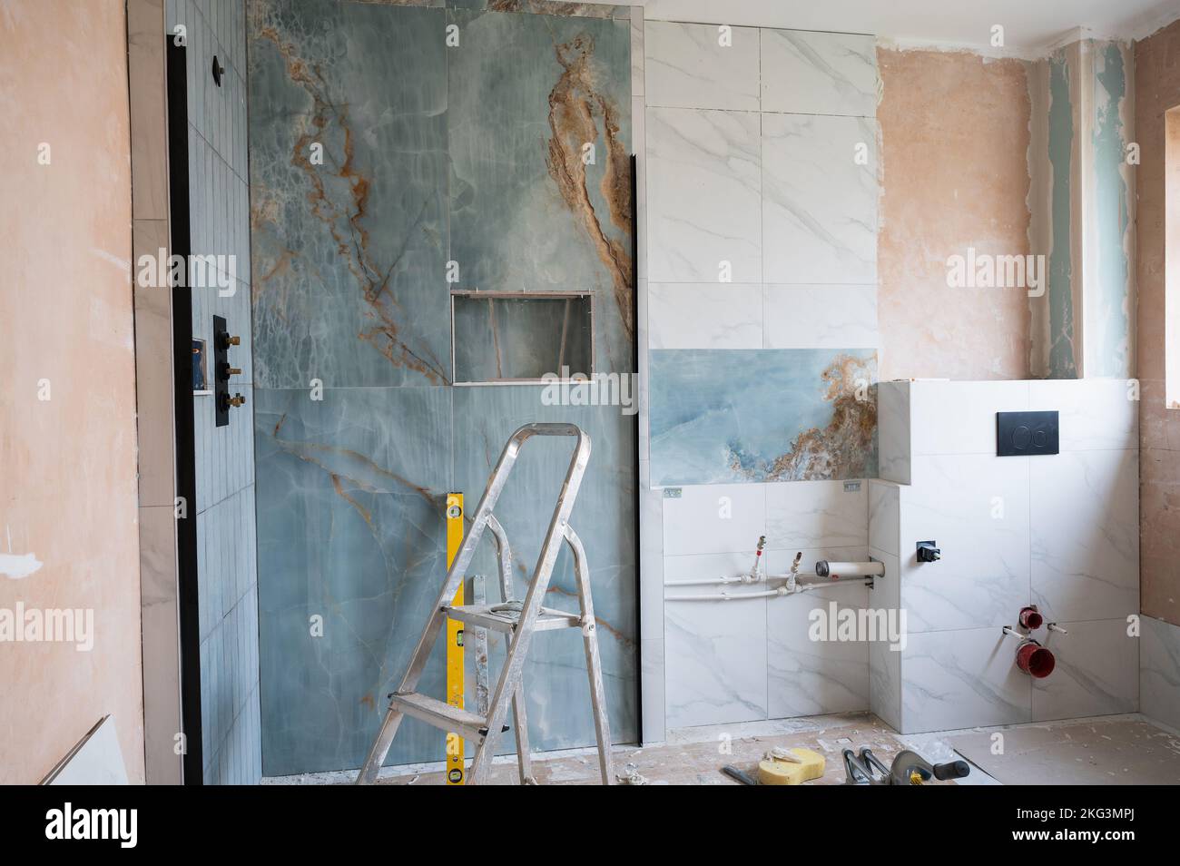 Unfinished diy project of shower room. White and light blue marble ...