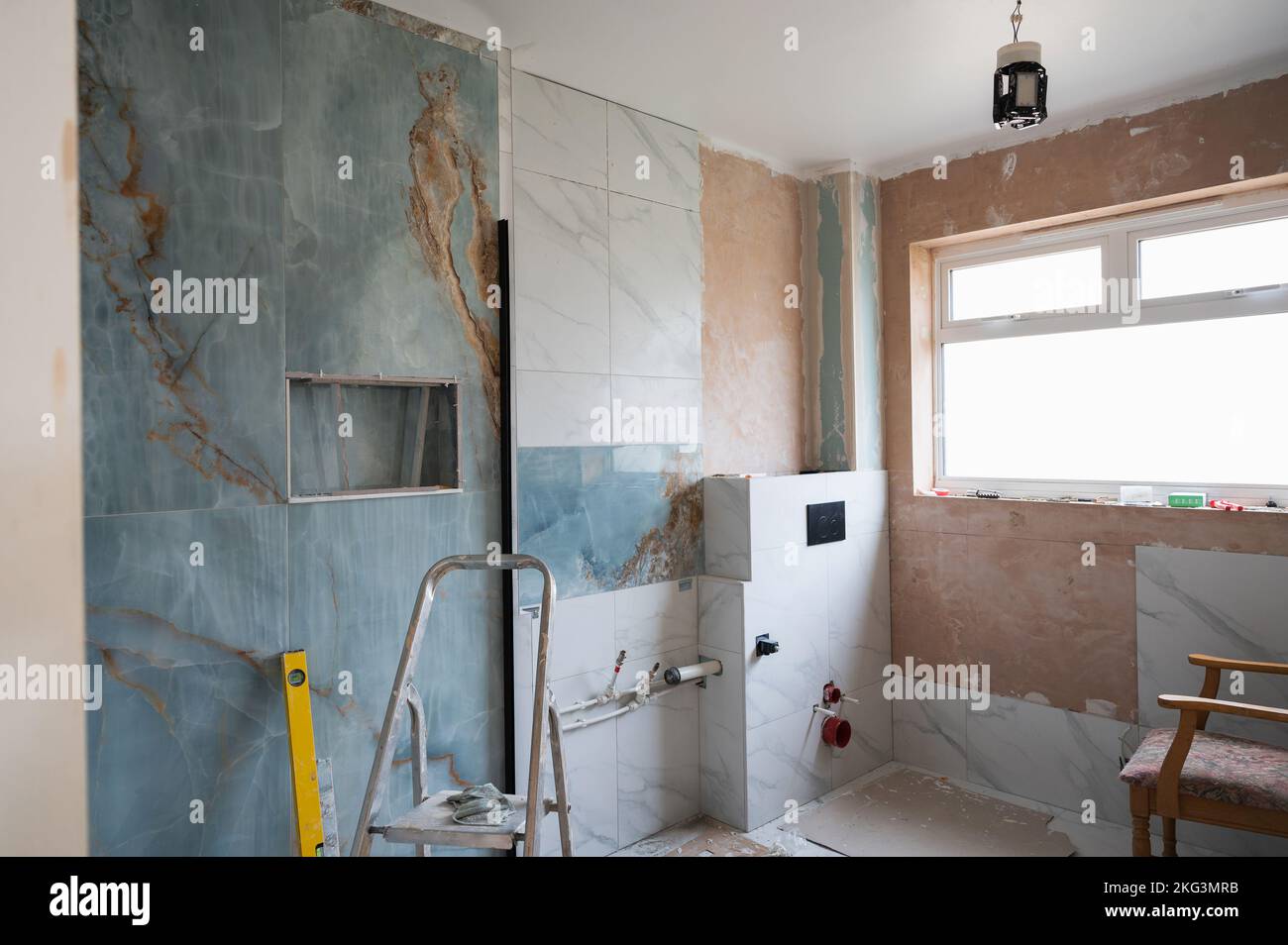Unfinished diy project of shower room. White and light blue marble ...