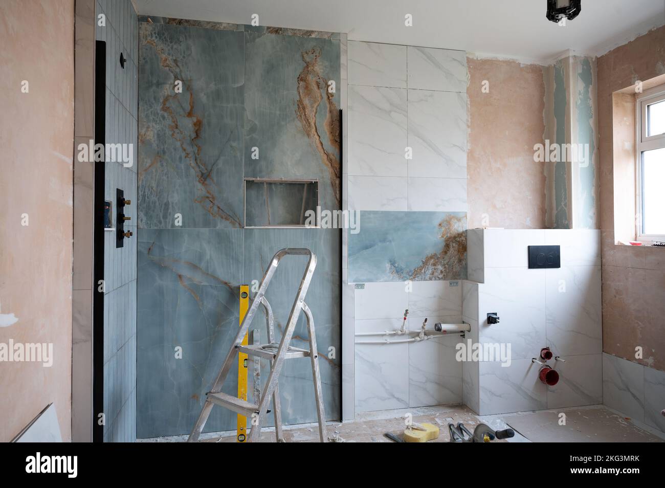 Unfinished diy project of shower room. White and light blue marble ...