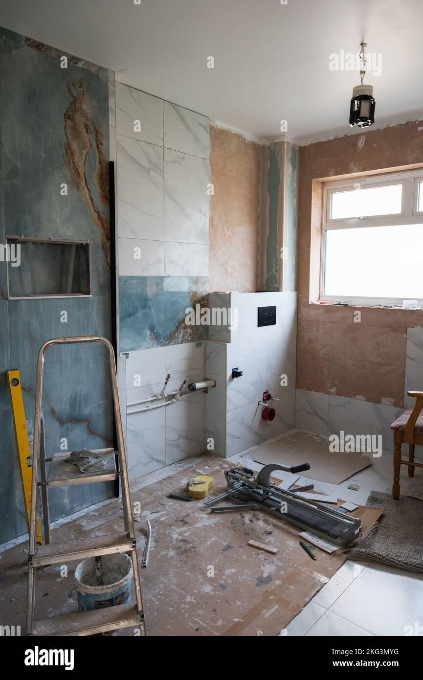 Unfinished diy project of shower room. White and light blue marble ...