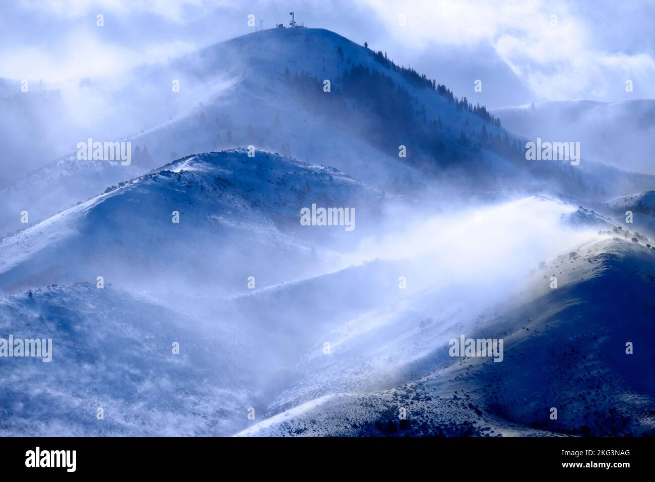 Mountains with blowing snow in winter storm snow squall high winds ...