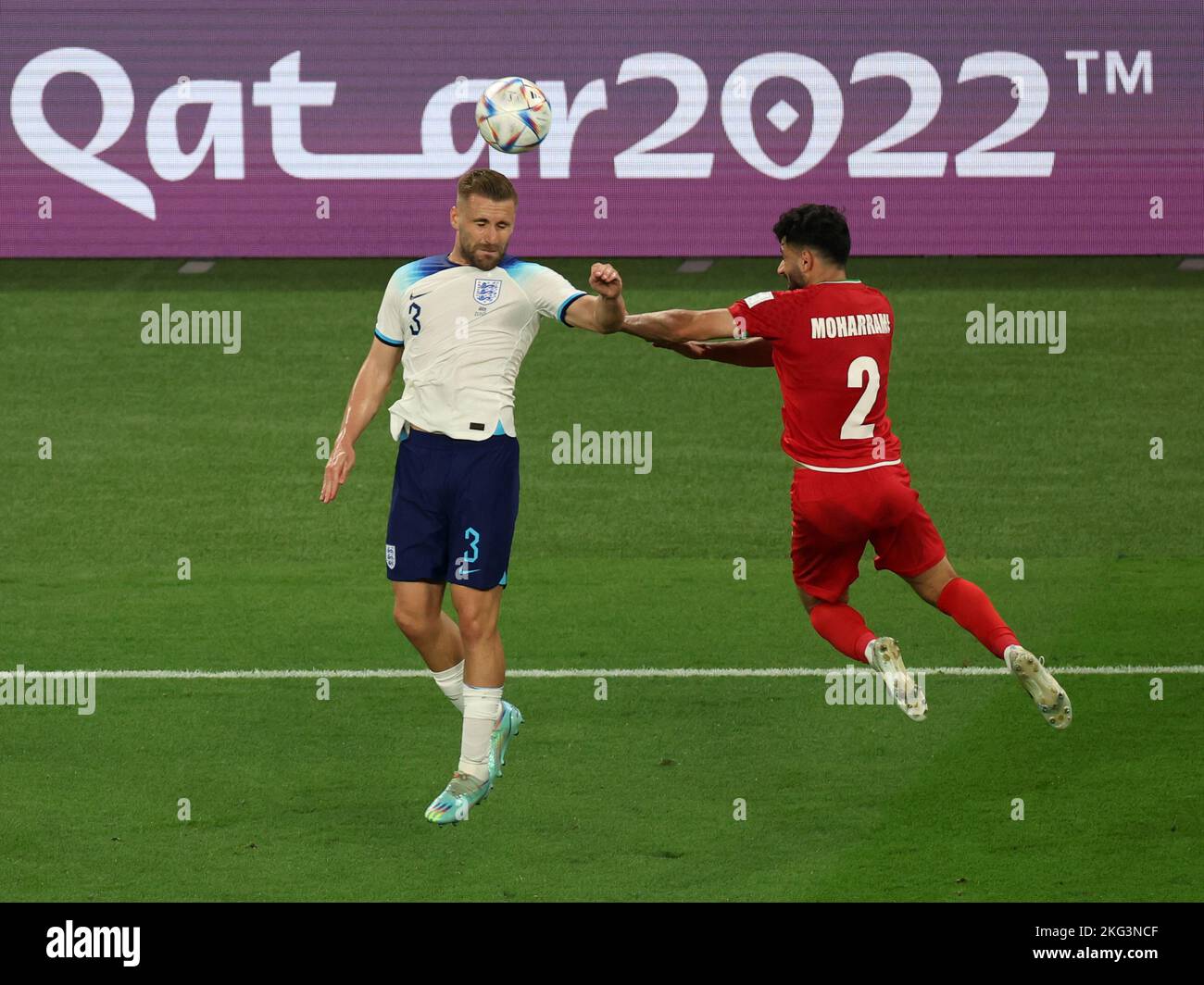 Doha, Qatar. 21st Nov, 2022. Luke Shaw (L) of England vies with Sadegh ...