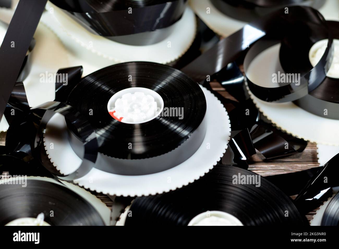 Tape ribbons with the supply and take up reels of VHS video cassette ...
