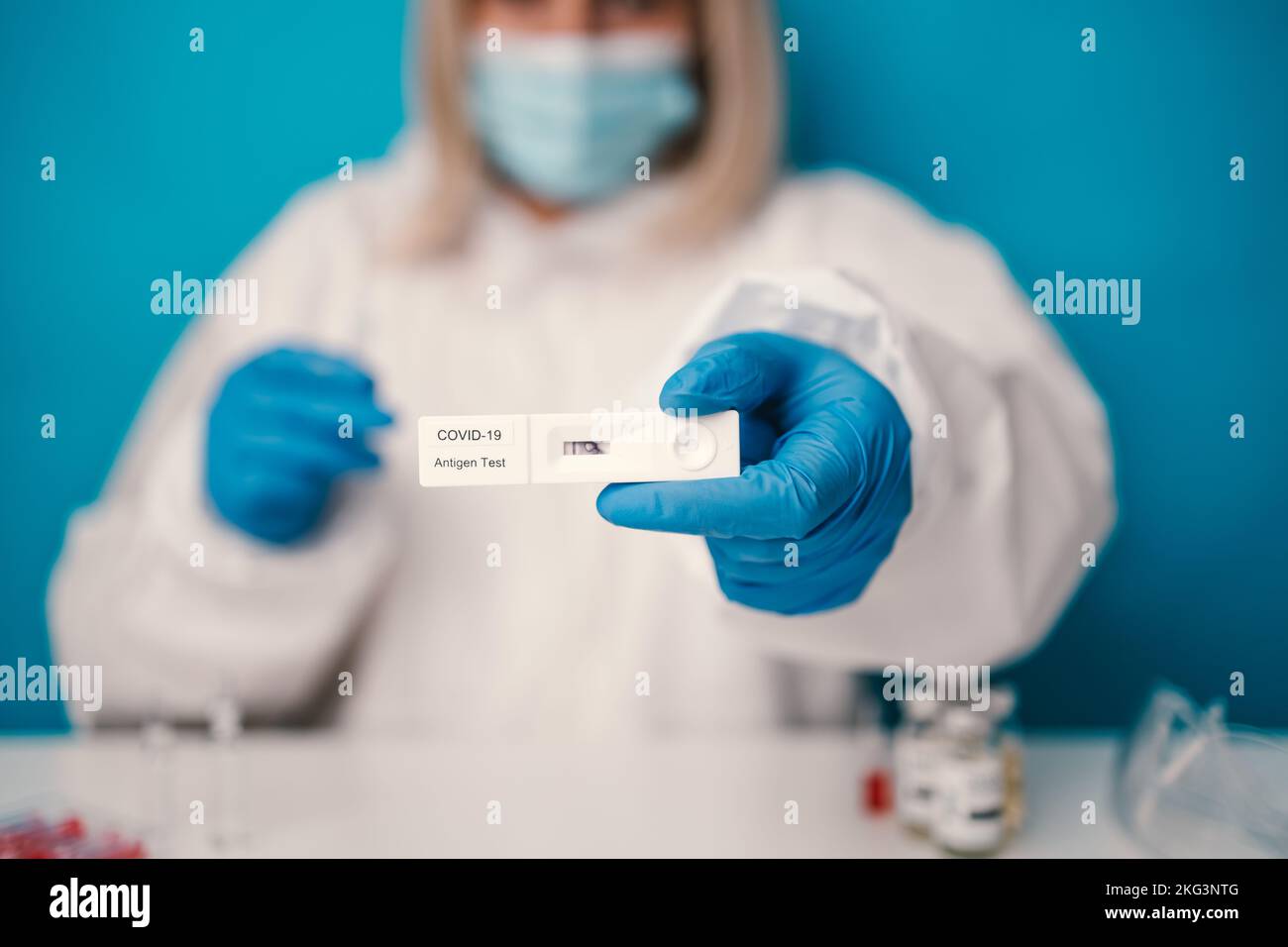 A laboratory employee taking sample PCR microtubes with cotton swab ...