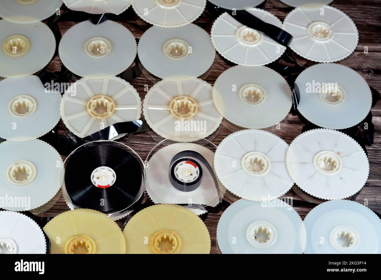 Stack of supply and take up reels with ribbon of VHS video cassette ...