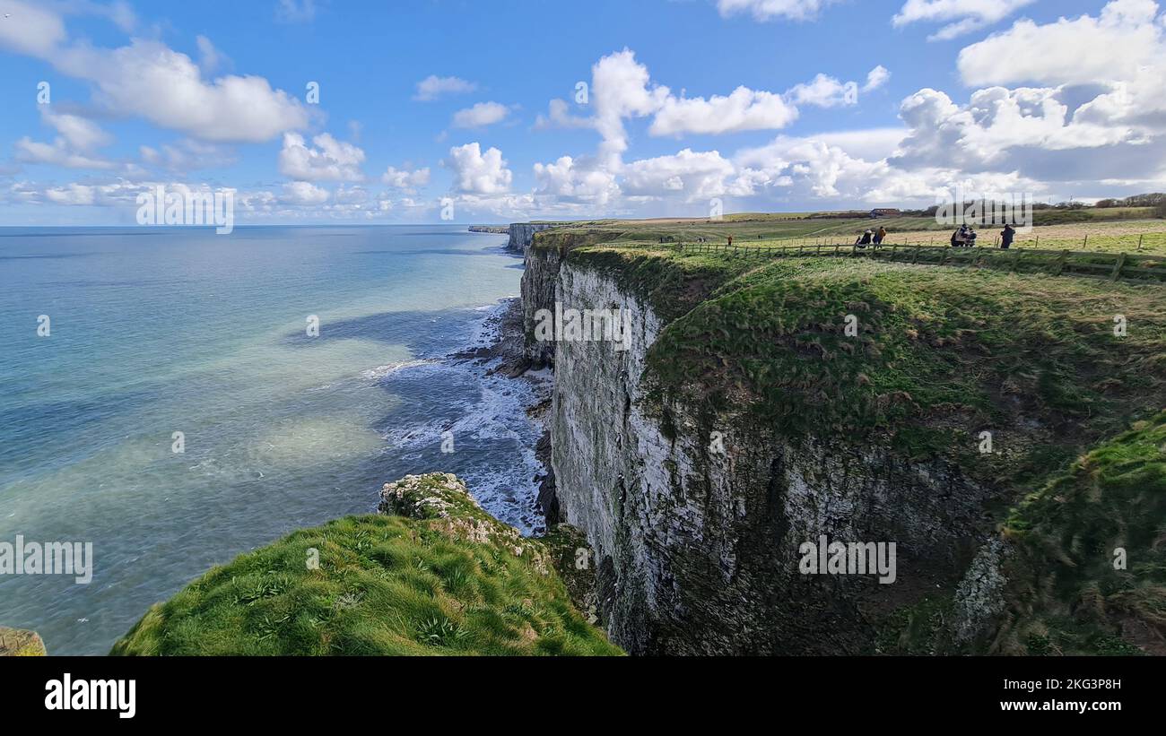 A rocky coast with cloudy sky on the background Stock Photo - Alamy