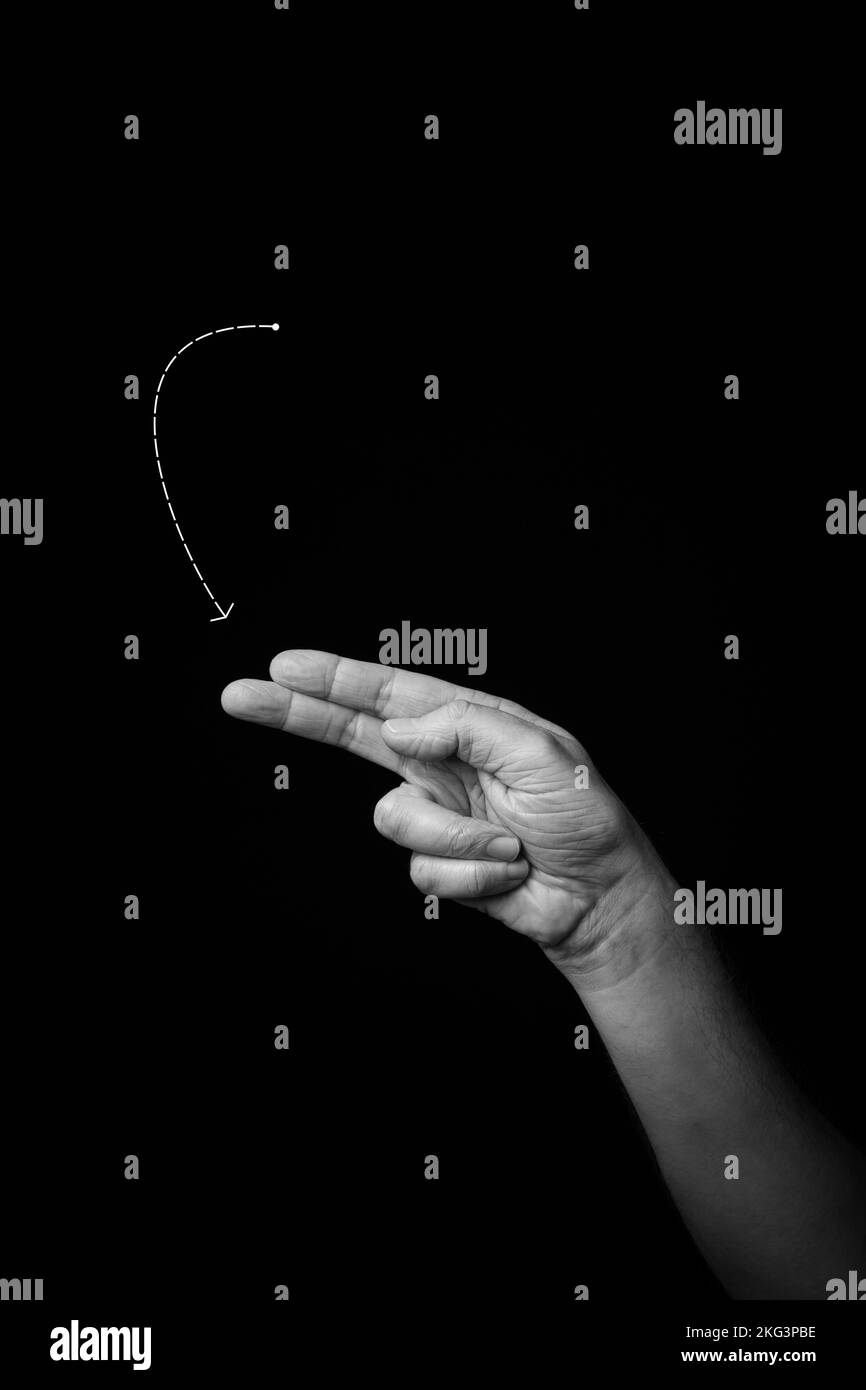 Dramatic black and white image of a male hand fingerspelling the Fench ...