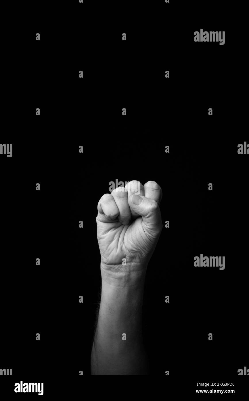Dramatic black and white image of a male hand fingerspelling the Fench ...