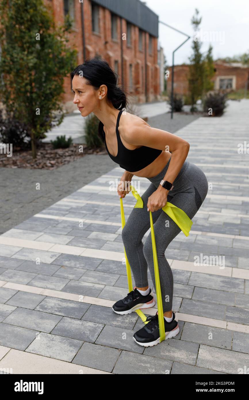 Fitness Woman Doing Workout Exercises With Rubber Elastic Resistance