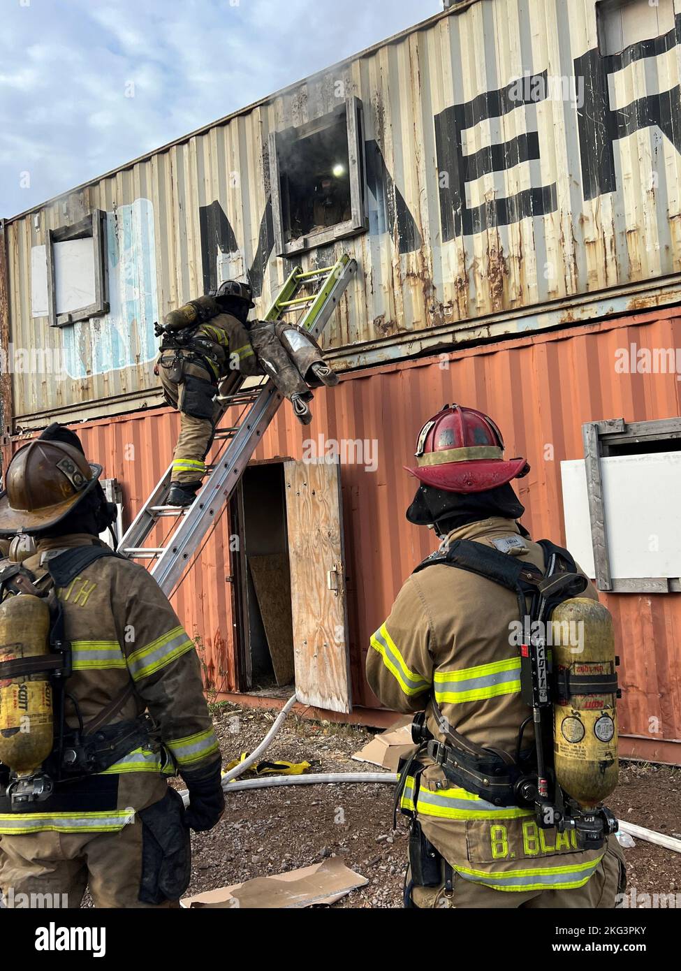 A fire fighter assigned to the Duluth Fire Department carries a ...