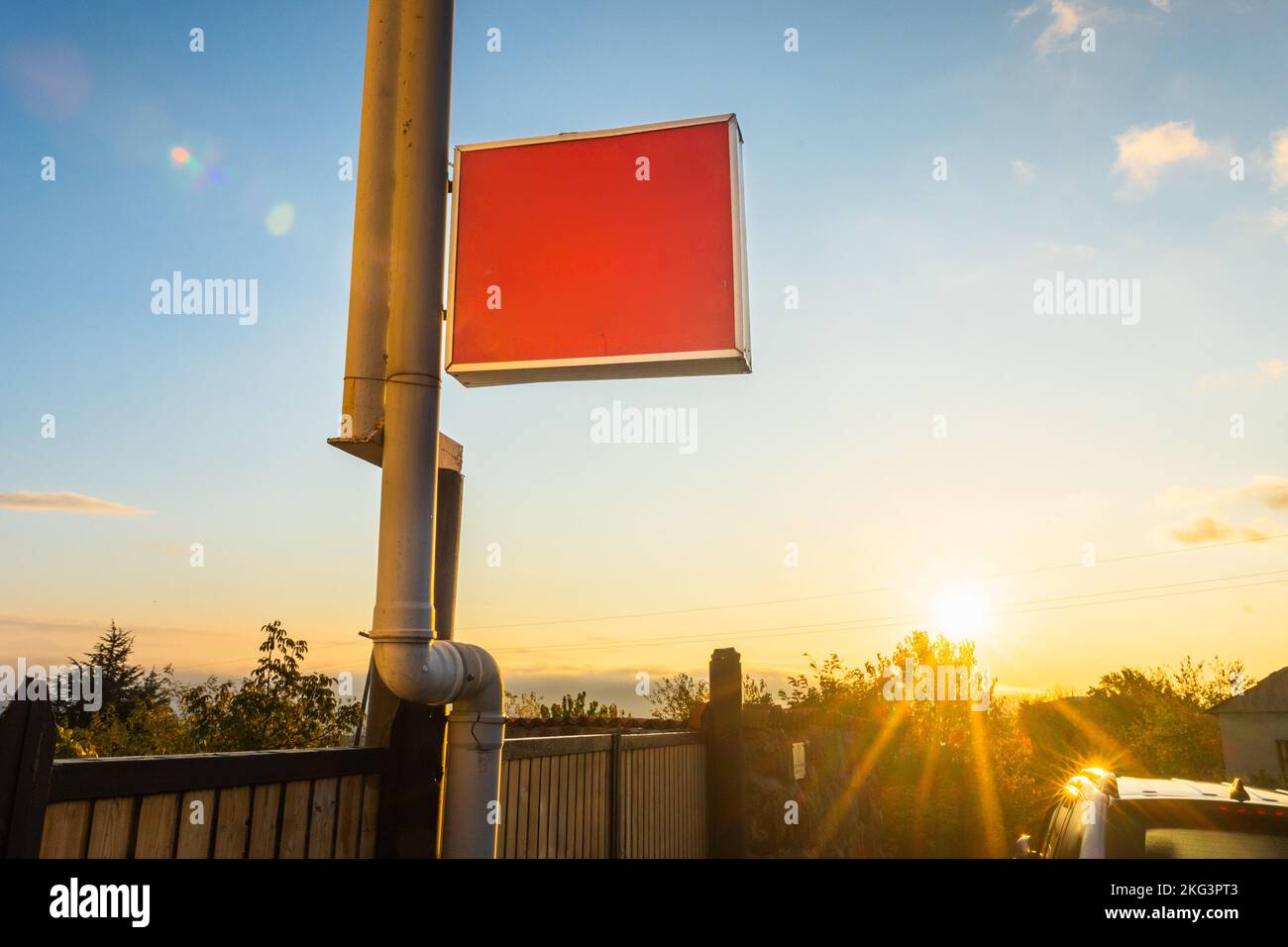 Blank red plastic signboard on post. Empty mounted sign plate mock up ...