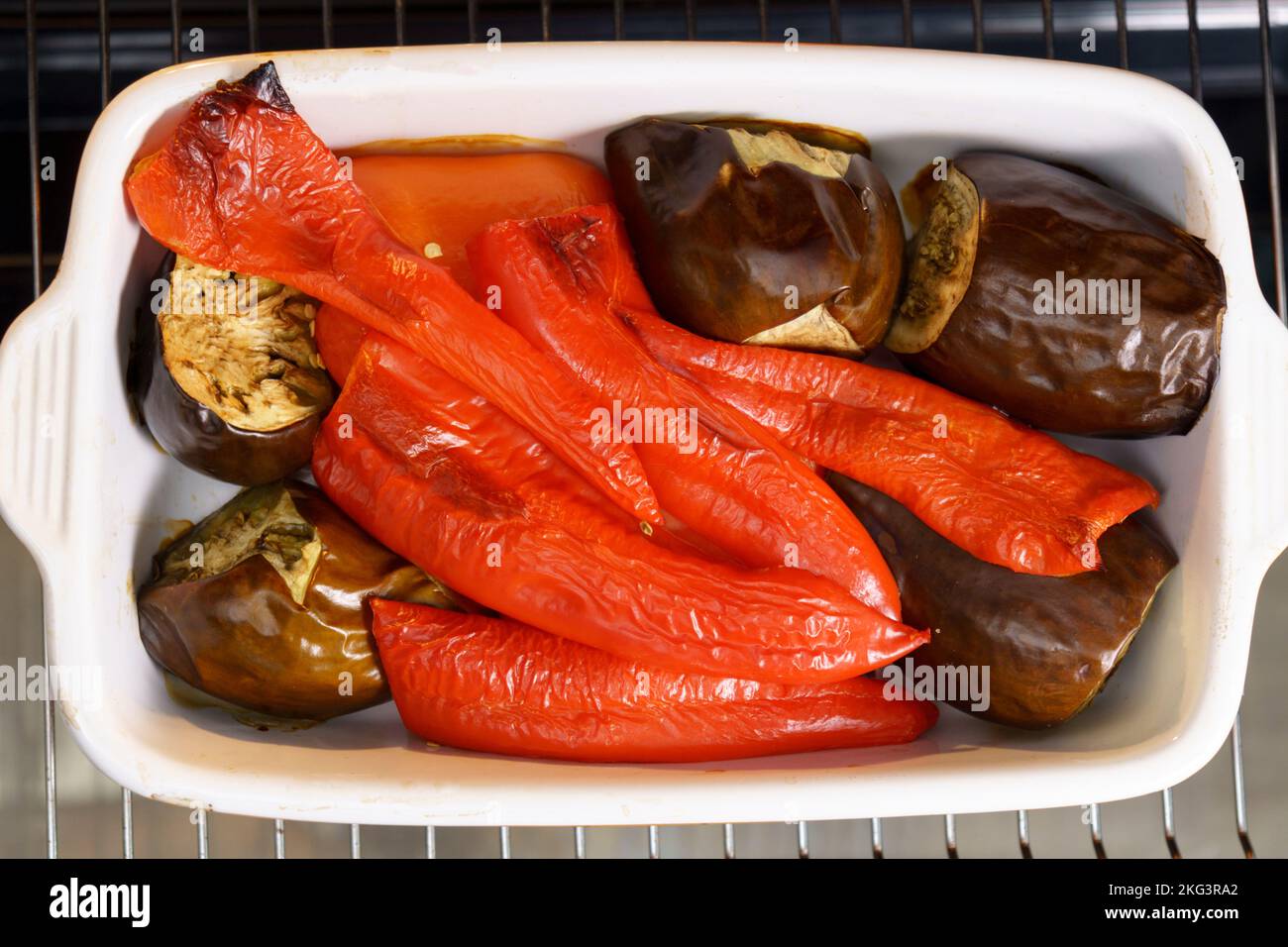 Preparing red peppers and eggplant for pepper sauce, ajvar, a ...