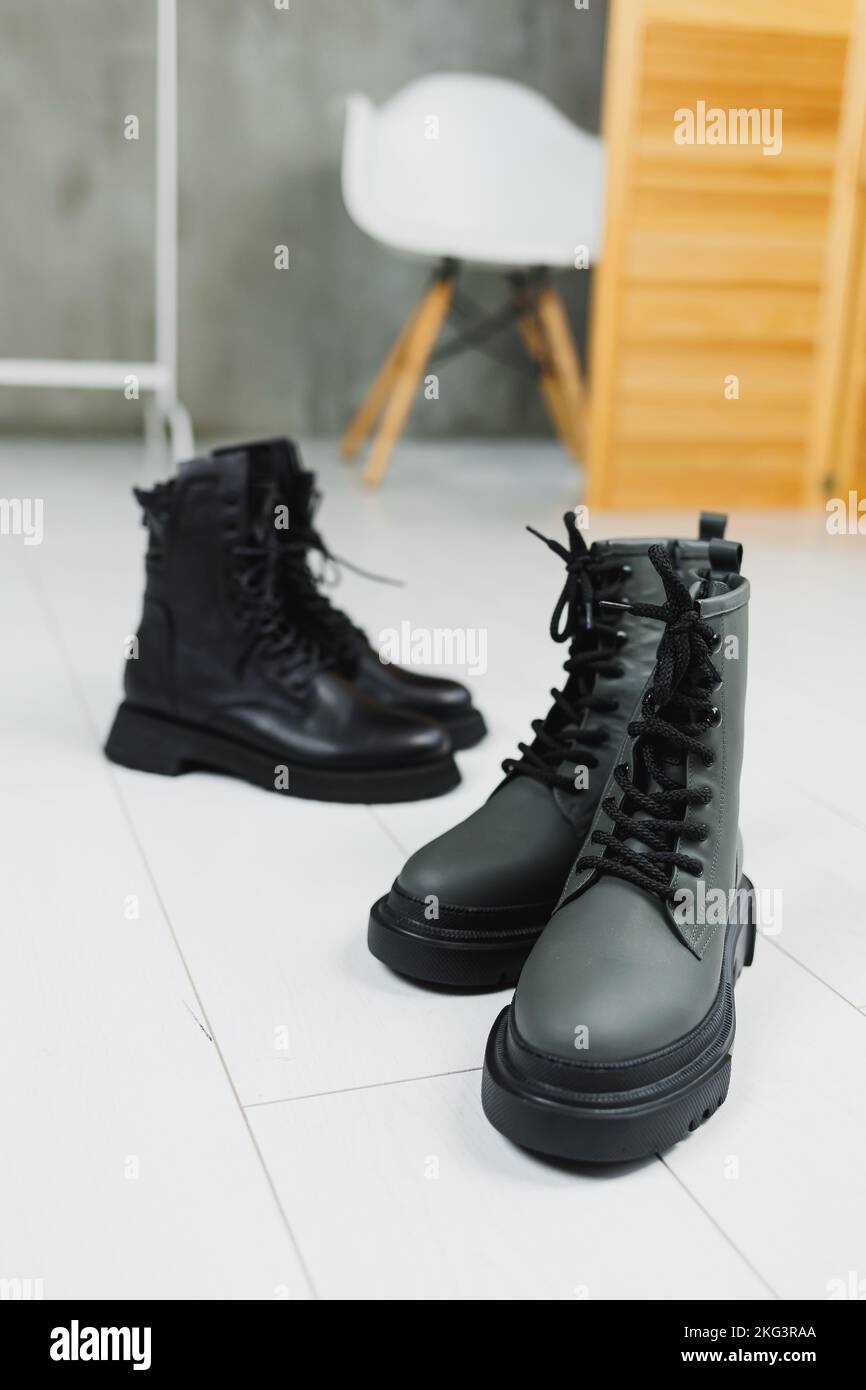 Several pairs of shoes lie on the floor. Winter black leather women's ...