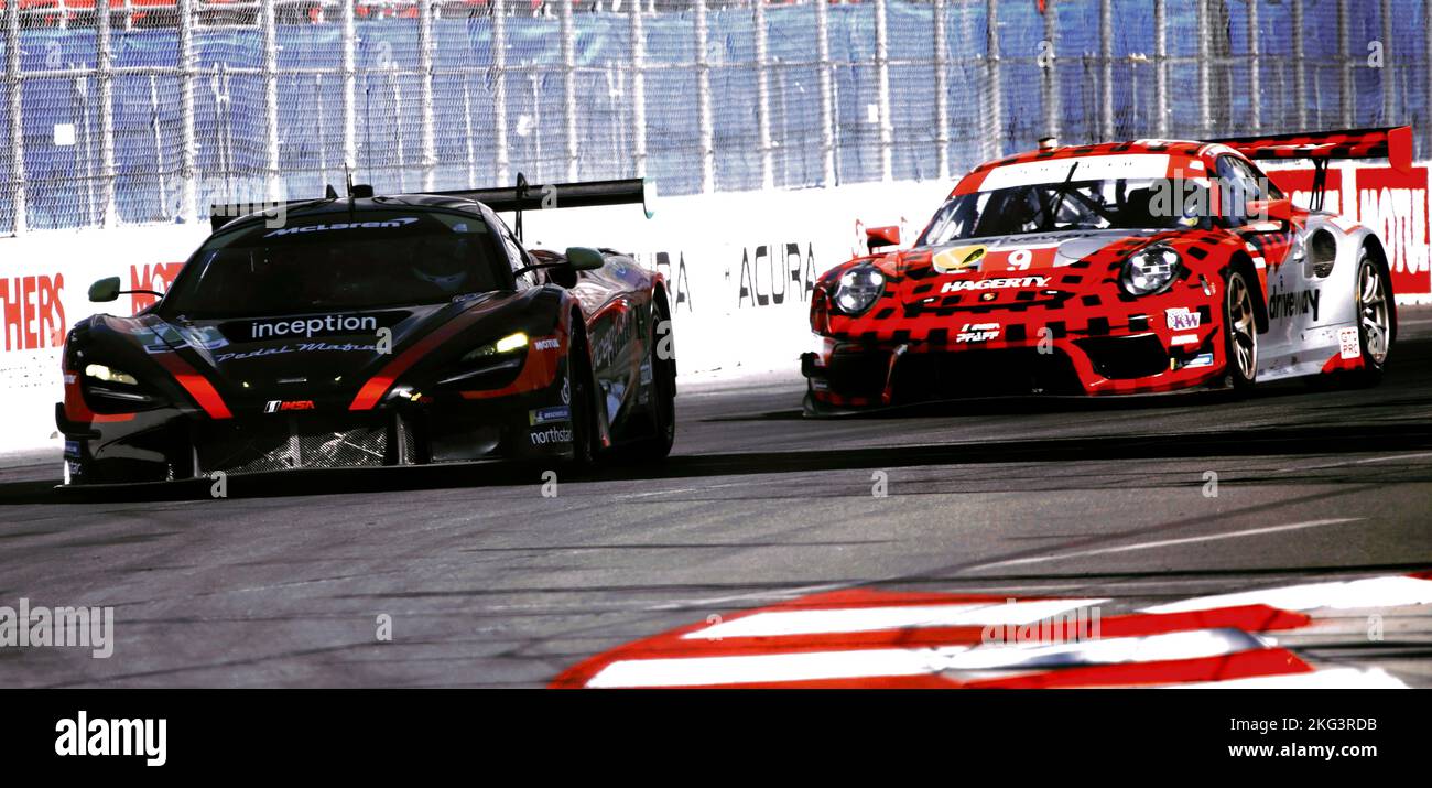 The racing final lap of McLaren and Porsche in the corner action Stock ...