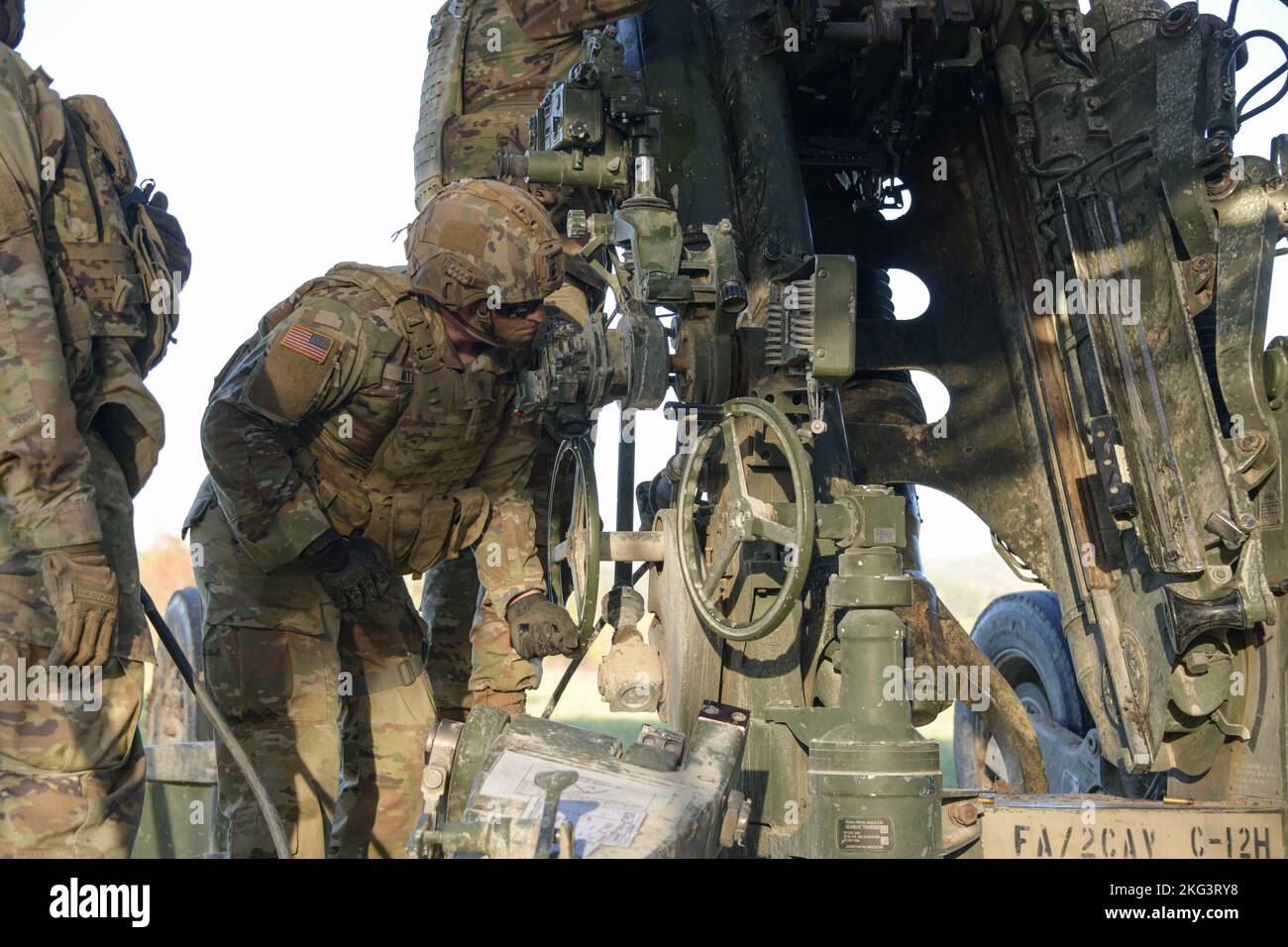 A U.S. Soldier assigned to Bravo Battery, Field Artillery Squadron, 2nd Cavalry Regiment aligns ...