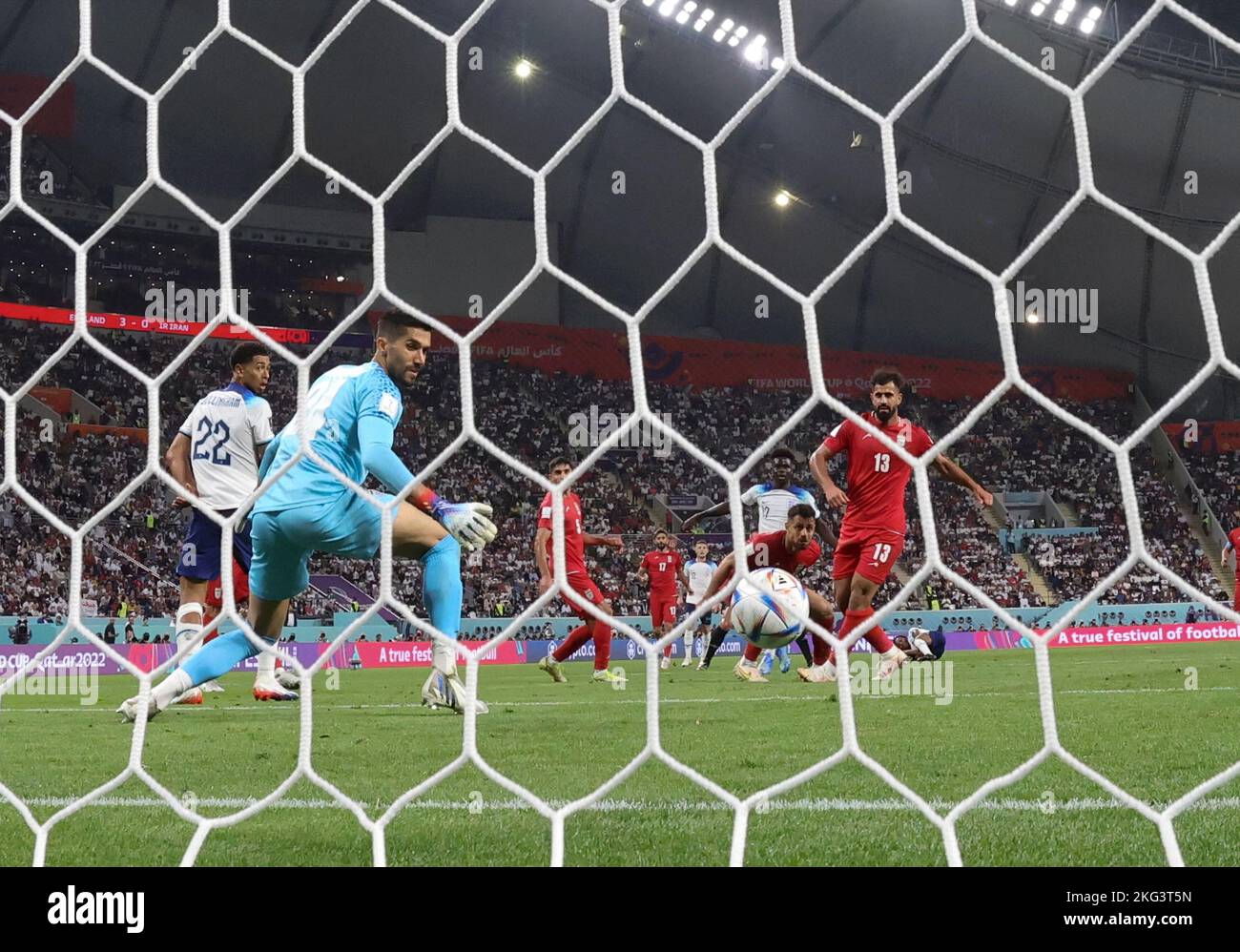 Doha, Qatar. 21st Nov, 2022. Bukayo Saka (3rd R) of England scores ...