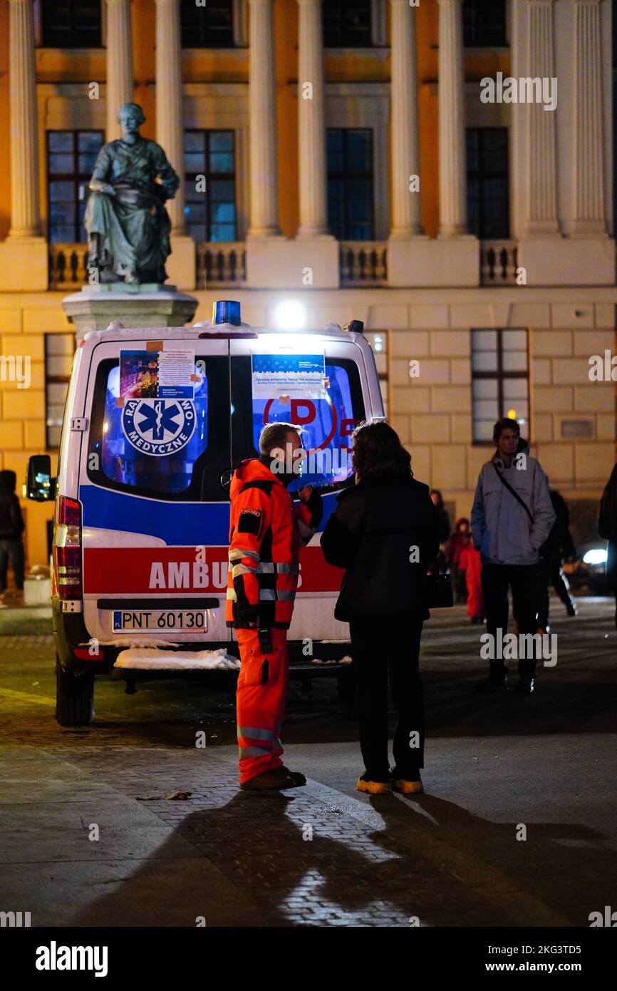 A vertical of a parked ambulance van with medics on the Plac Wolnosci ...