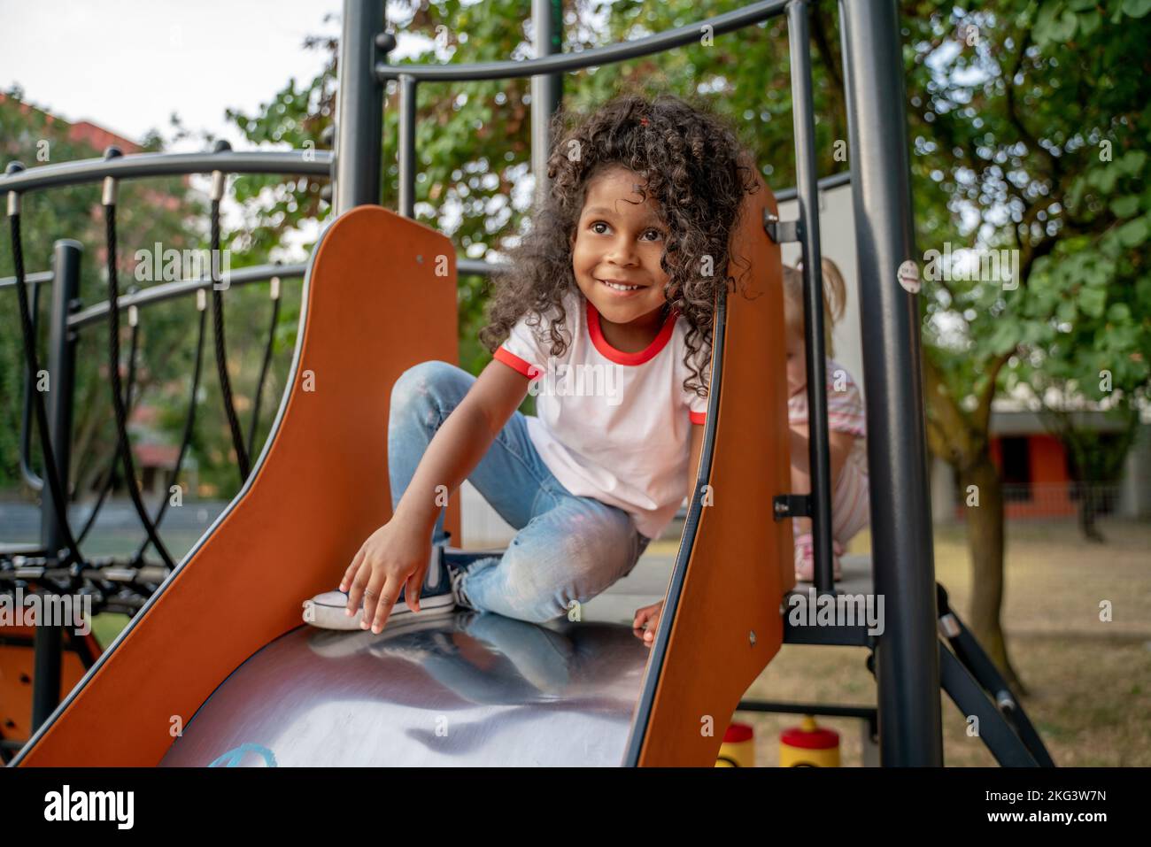 Two kids involved in an outdoor activity Stock Photo - Alamy