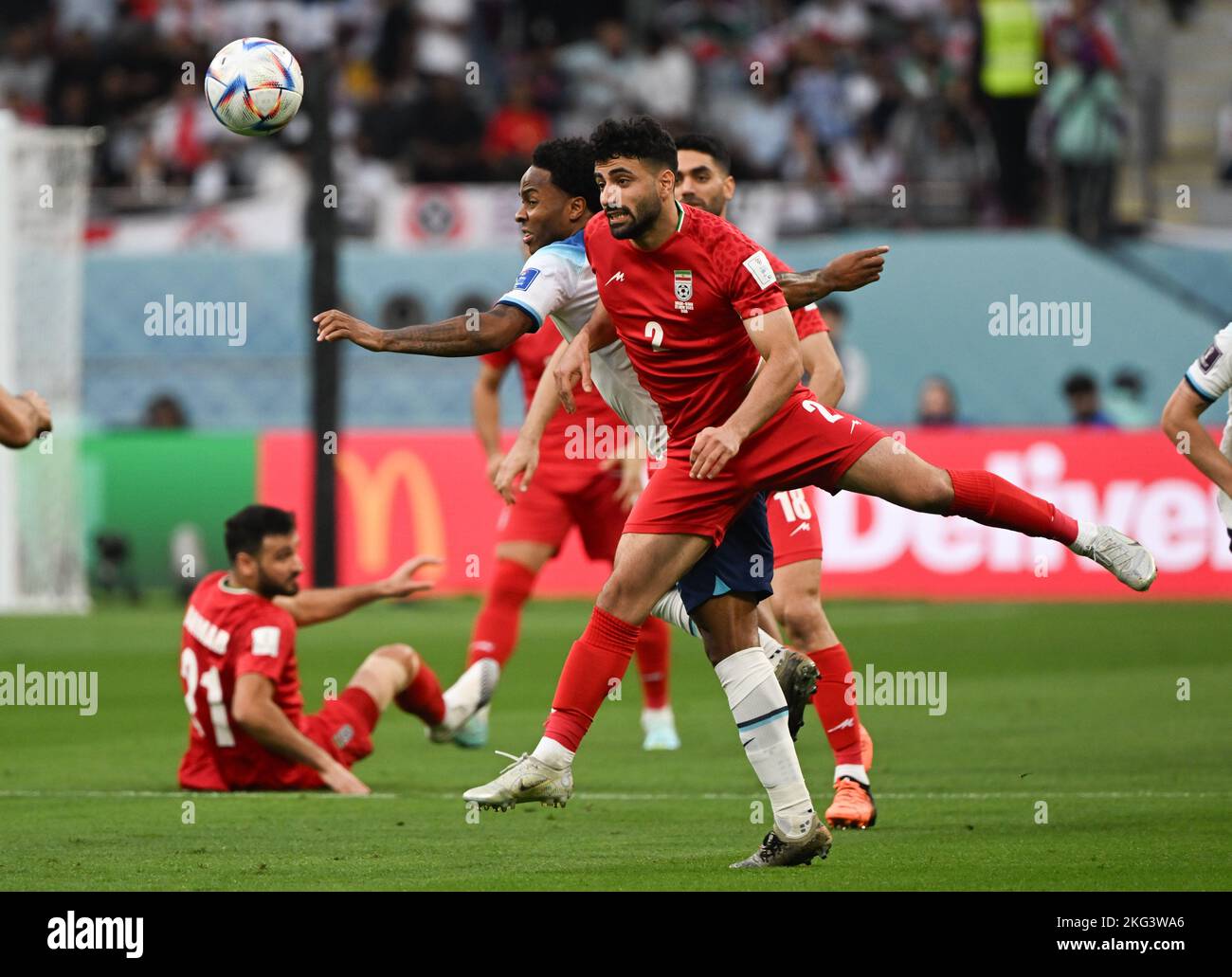 Doha, Qatar. 21st Nov, 2022. Raheem Sterling (front L) of England vies ...
