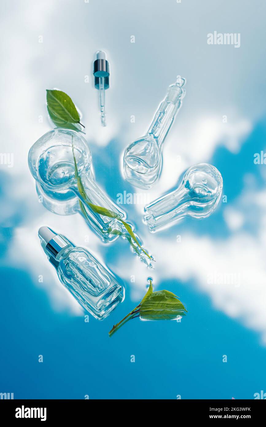 Abstract cosmetic laboratory, laboratory glassware on a mirror ...