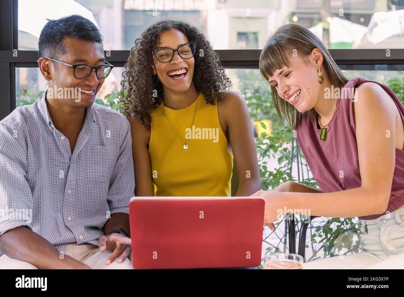 portrait of three excited students reading good news togheter on ...