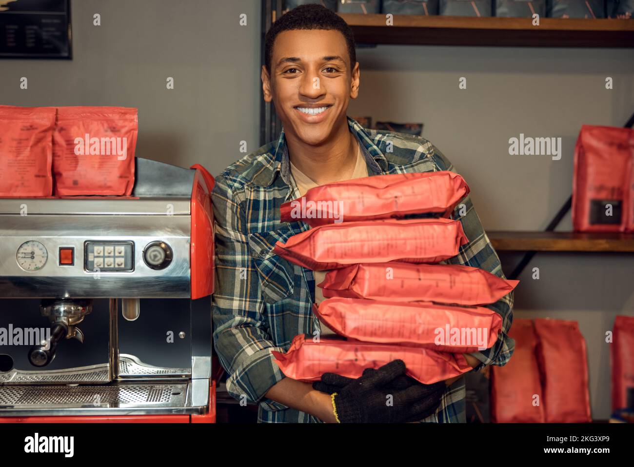 Smiling man cafe holding camera hi-res stock photography and images - Alamy