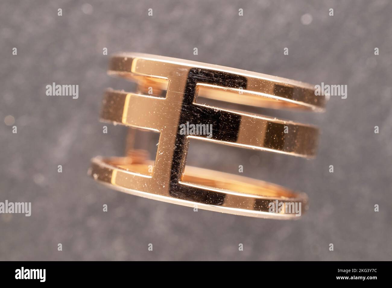 One gold ring on slate stone, macro, top view Stock Photo - Alamy