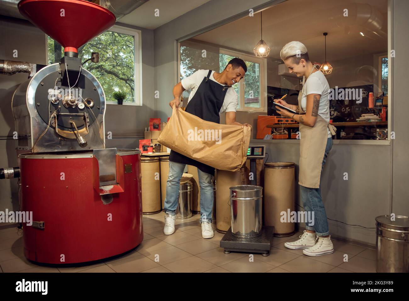 Staff measuring the product weight on the platform scales Stock Photo - Alamy