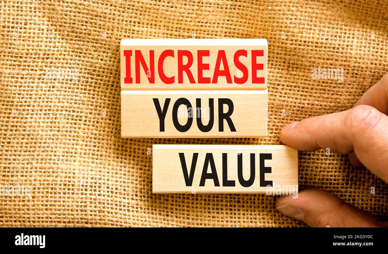 Increase your value symbol. Concept words Increase your value on wooden ...