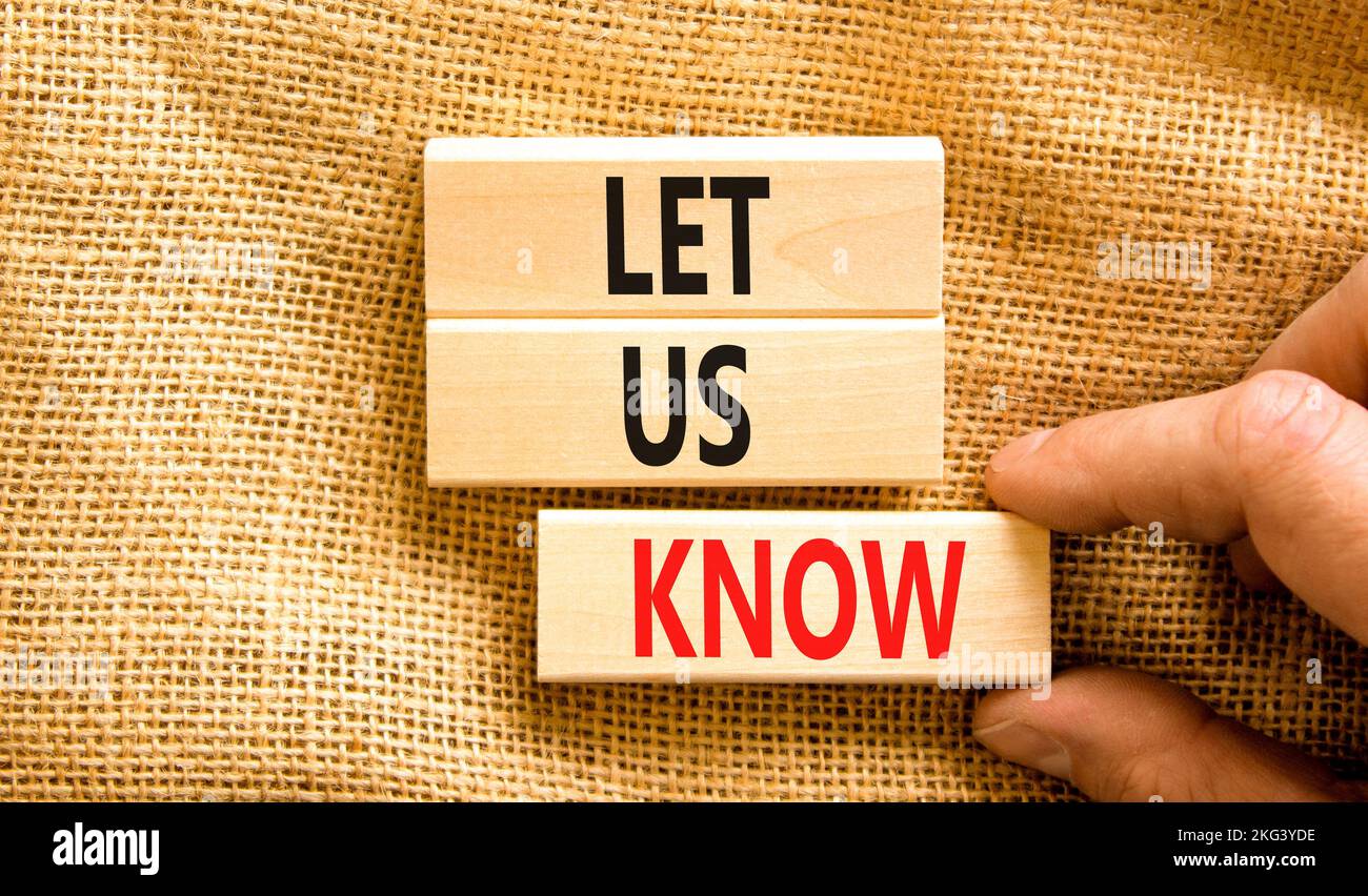 Let us know symbol. Concept words Let us know on wooden blocks on a ...