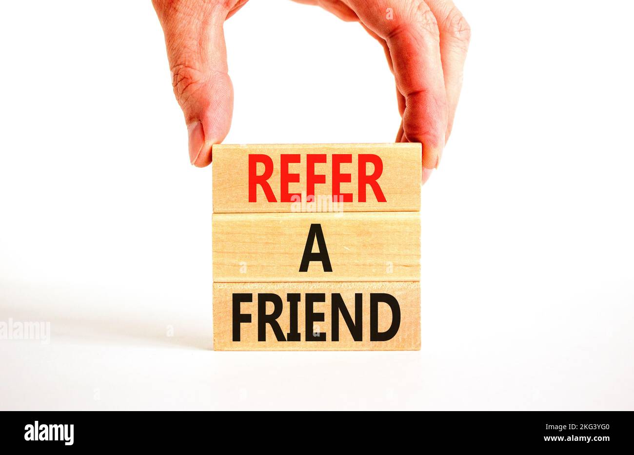 Refer a friend symbol. Concept words Refer a friend on wooden blocks on ...