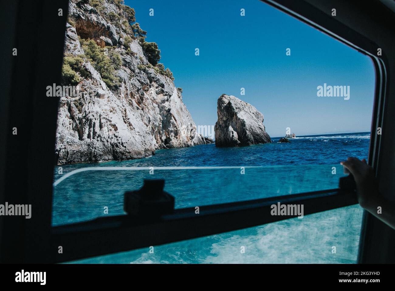 View of the Rocky Sea Coast trough the Ship Window Stock Photo - Alamy